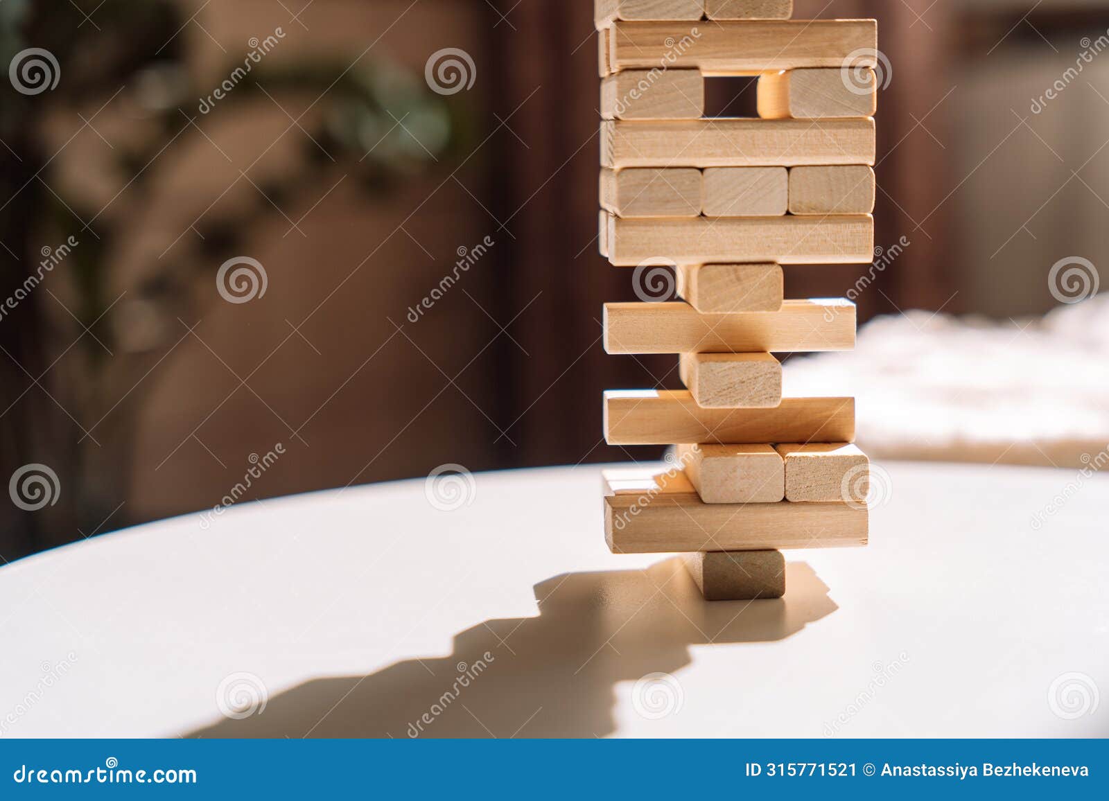 Jenga Under Sunlight on a White Table in a Room Opposite the Window ...