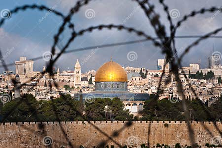 Jerusalem through Razor Wire Stock Image - Image of landmark, cross ...