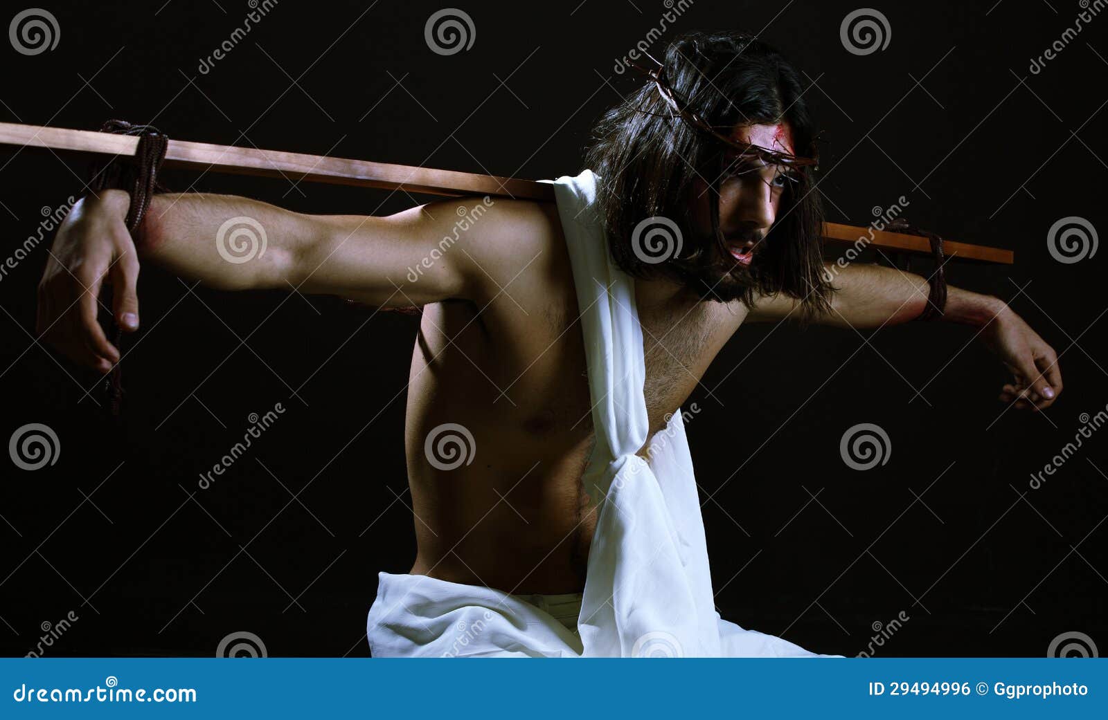 Jesus Christ with Cross Strapped To His Back Stock Photo - Image of ...