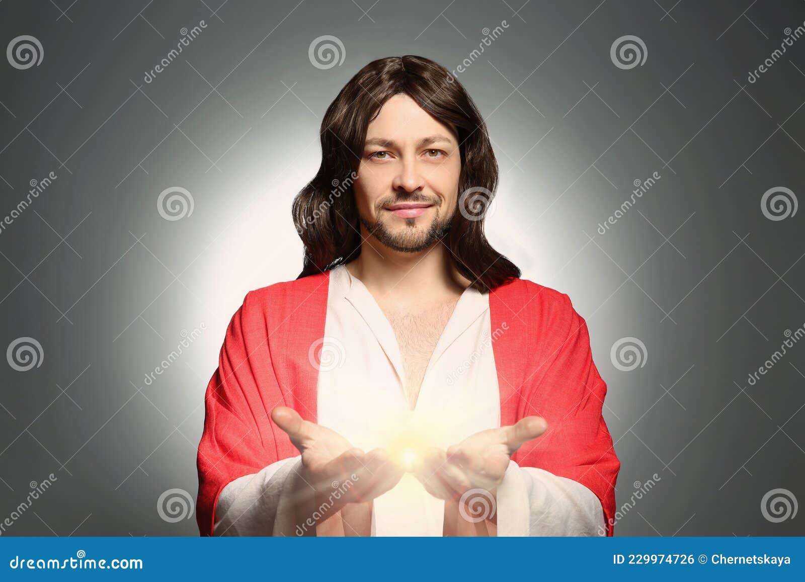 Jesus Christ on Grey Background. Miraculous Light in Hands Stock Photo ...