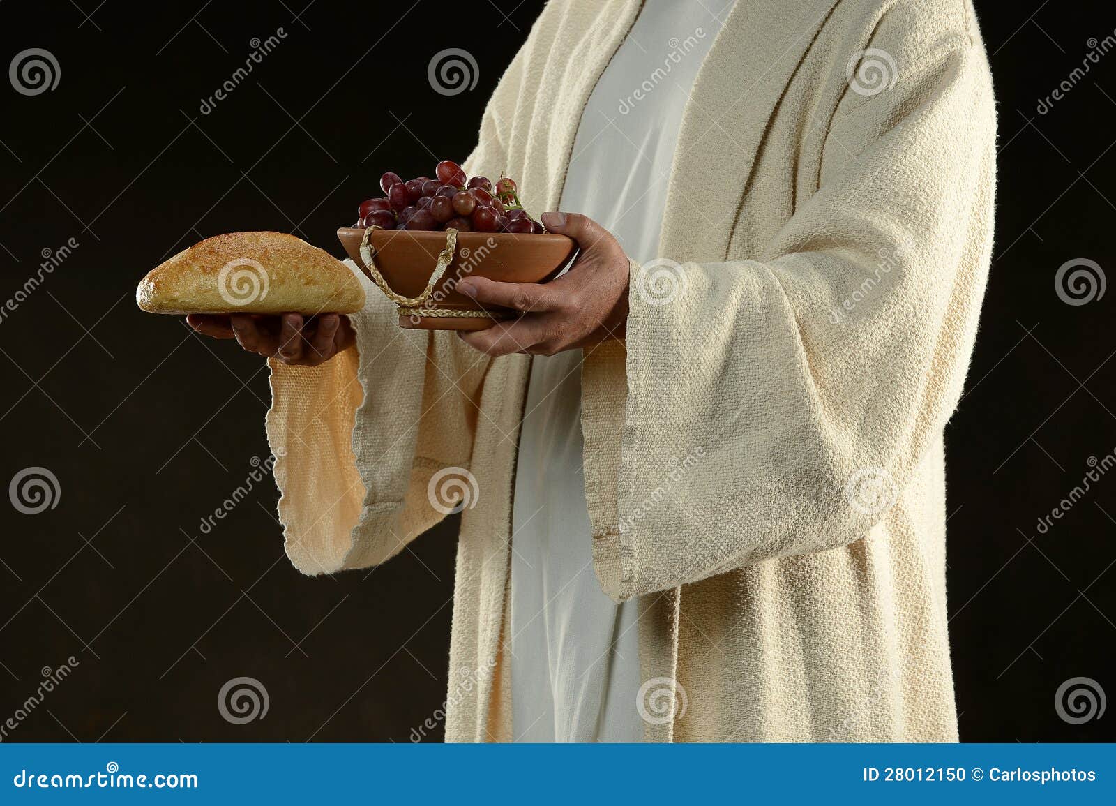 Jesus Holding a Bread and Grapes Stock Photo - Image of jesuschrist ...