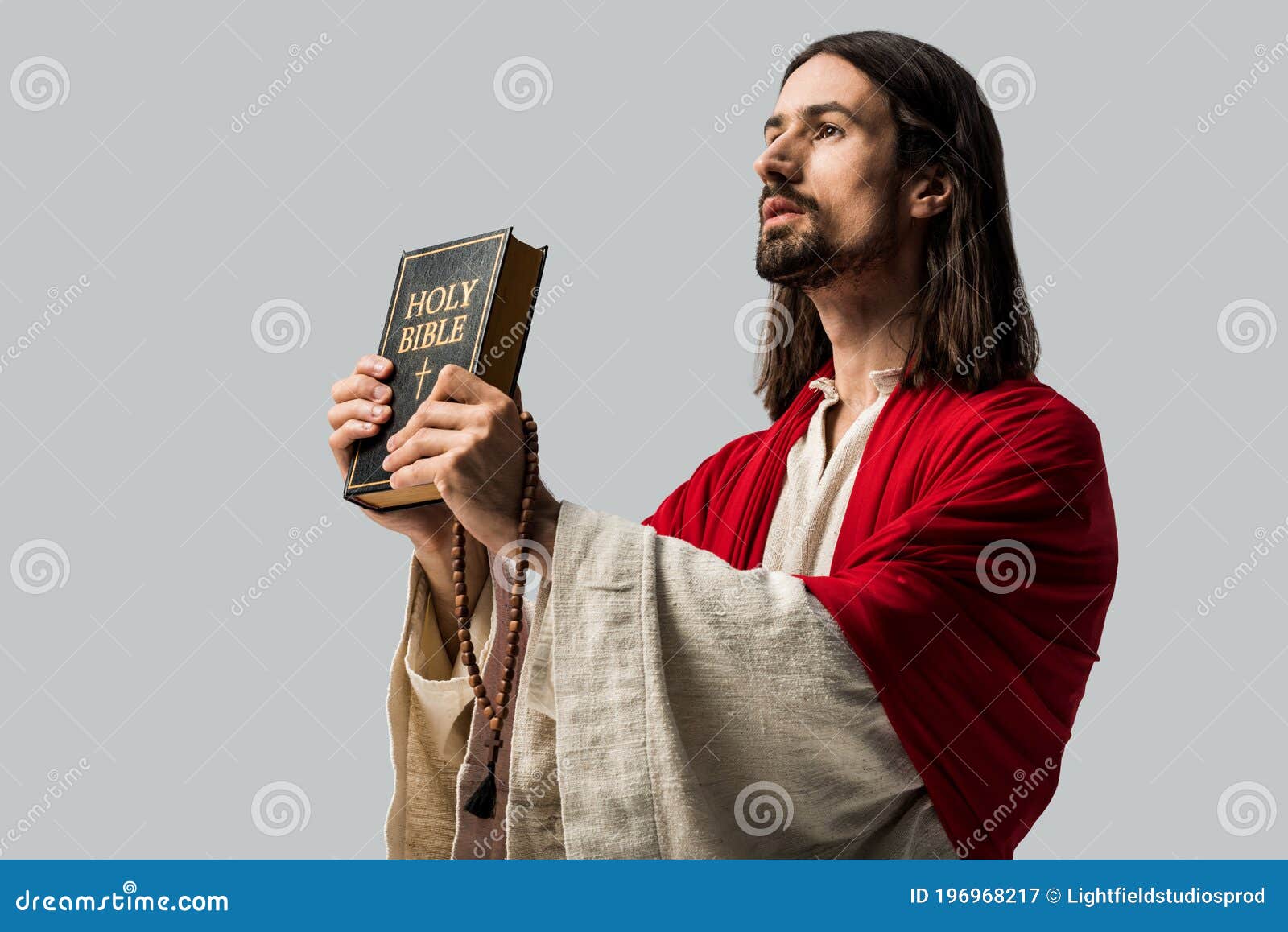 Jesus Holding Holy Bible Isolated on Grey Stock Image - Image of ...