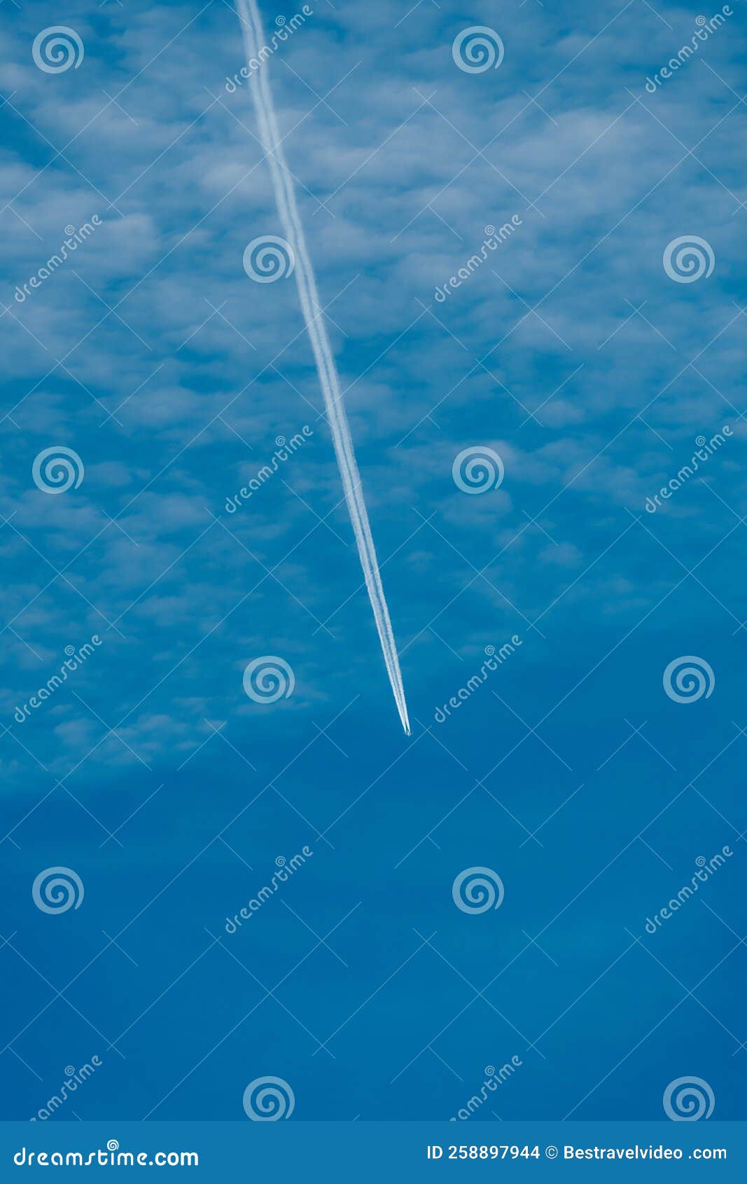 Jet Airplane Flying in a Blue Sky Forming White Contrails Stock Photo ...