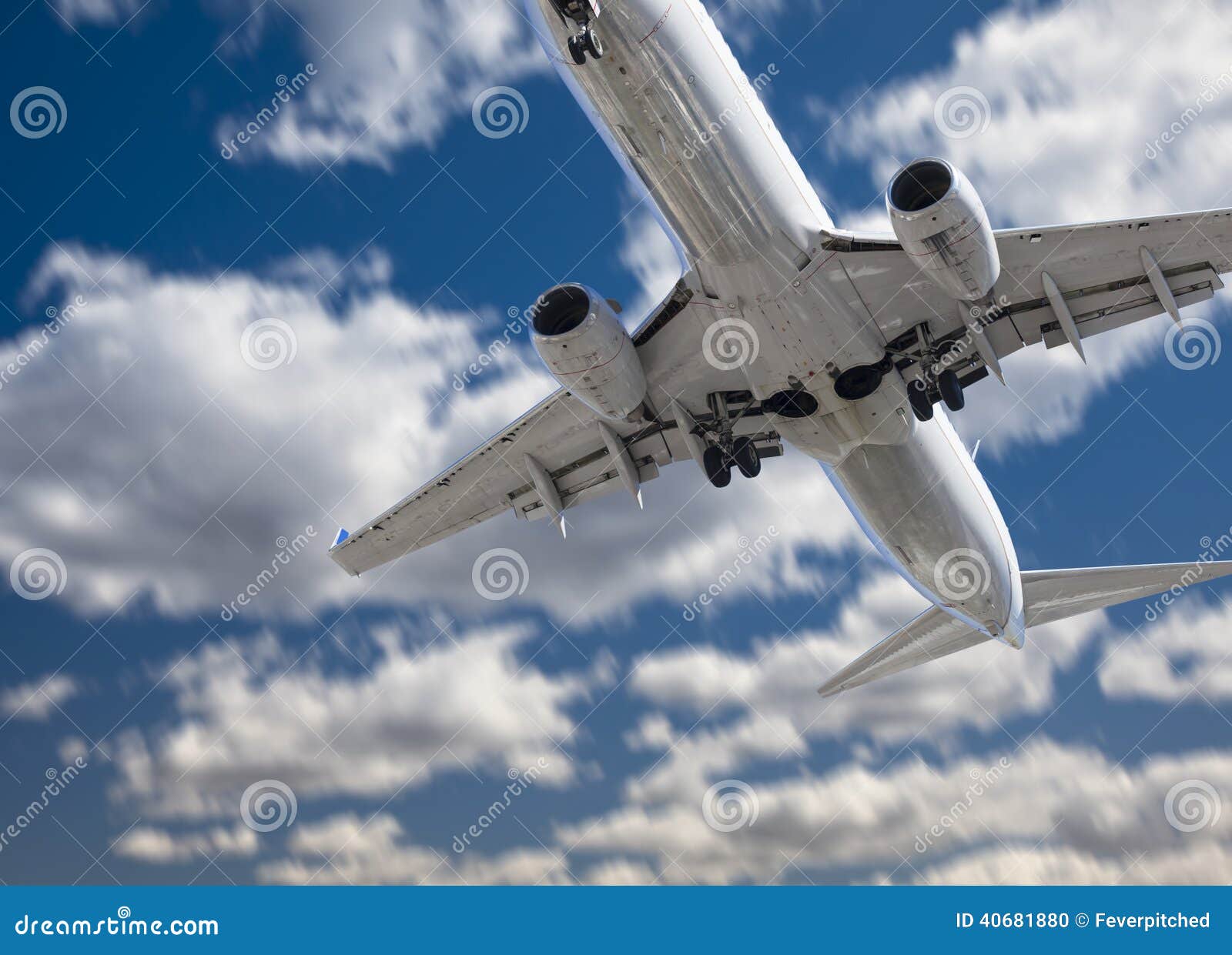 Jet Airplane Landing with Dramatic Clouds Behind Stock Photo - Image of ...