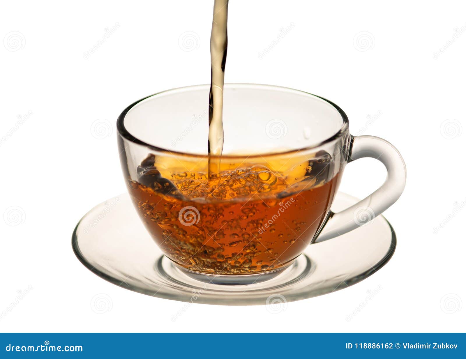 A Jet of Tea Flows into the Tea Cup, in Isolation Stock Photo - Image ...