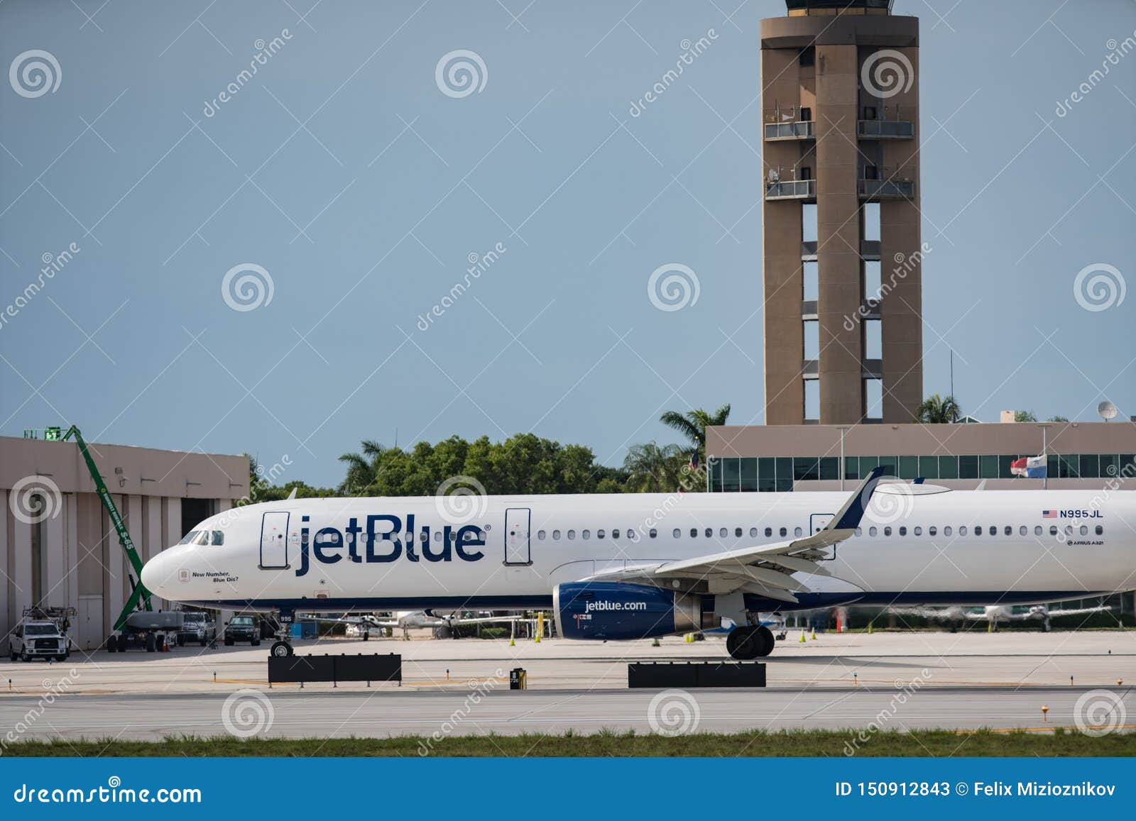 Jet Blue Airplane with Airport Tower in Background Editorial Stock ...