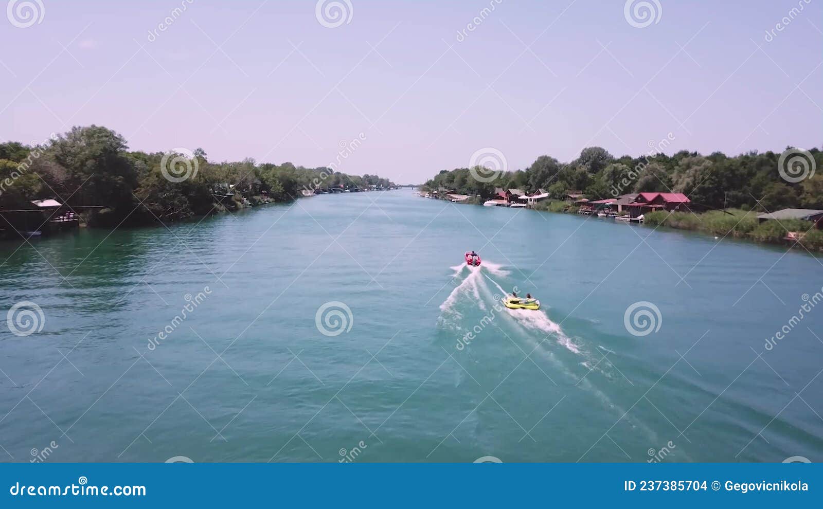 Jet Boat Pulling Two People on a River Stock Footage - Video of ...