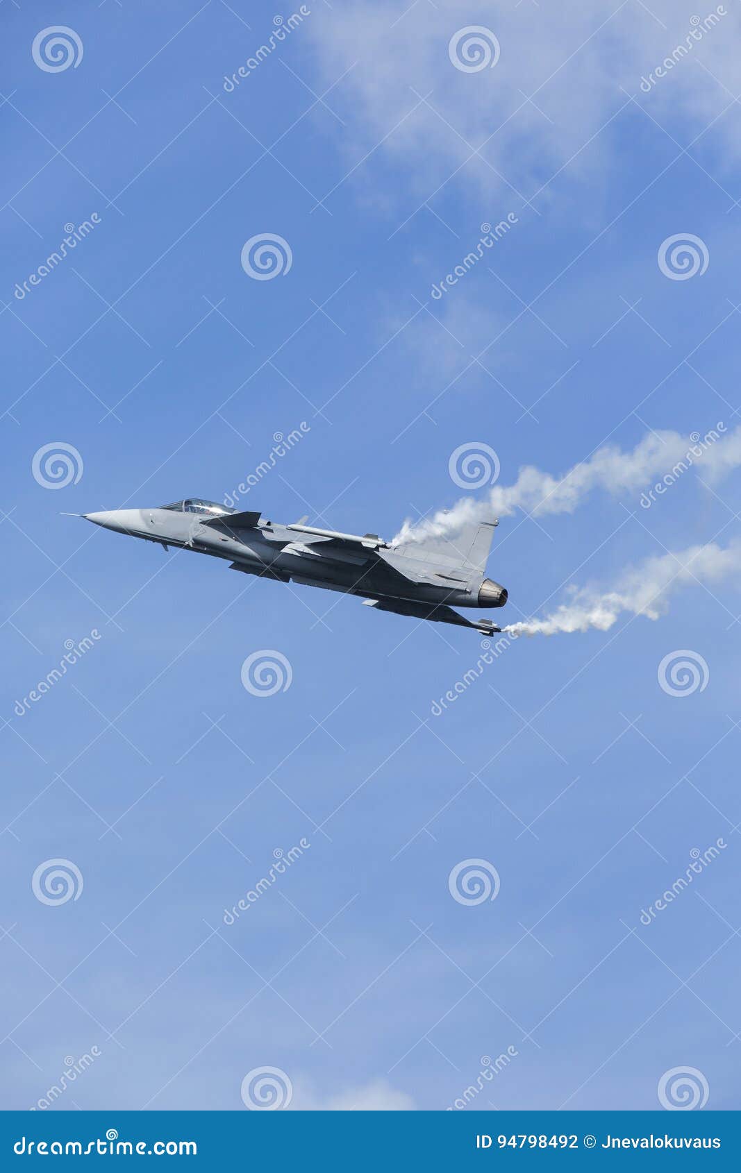 A Fighter Jet Flying Through A Cloudy Sky With Lightning Bolting Behind ...