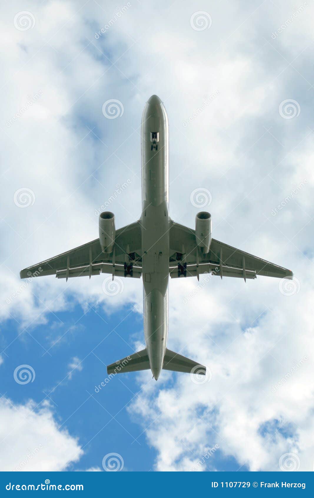 Jet Landing with Clouds stock image. Image of airplane - 1107729