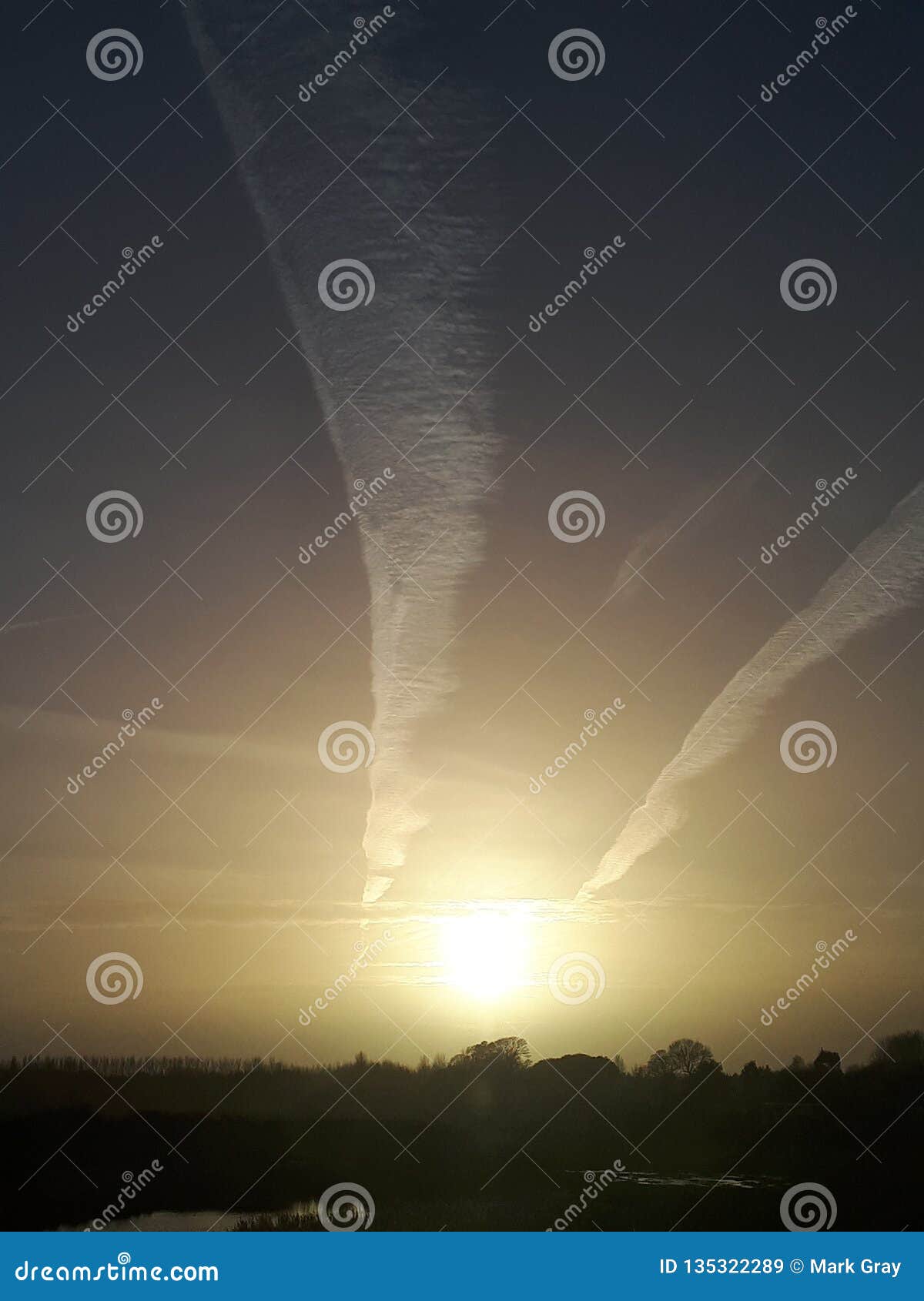Jet Lines at Sunset stock image. Image of clouds, sunset - 135322289