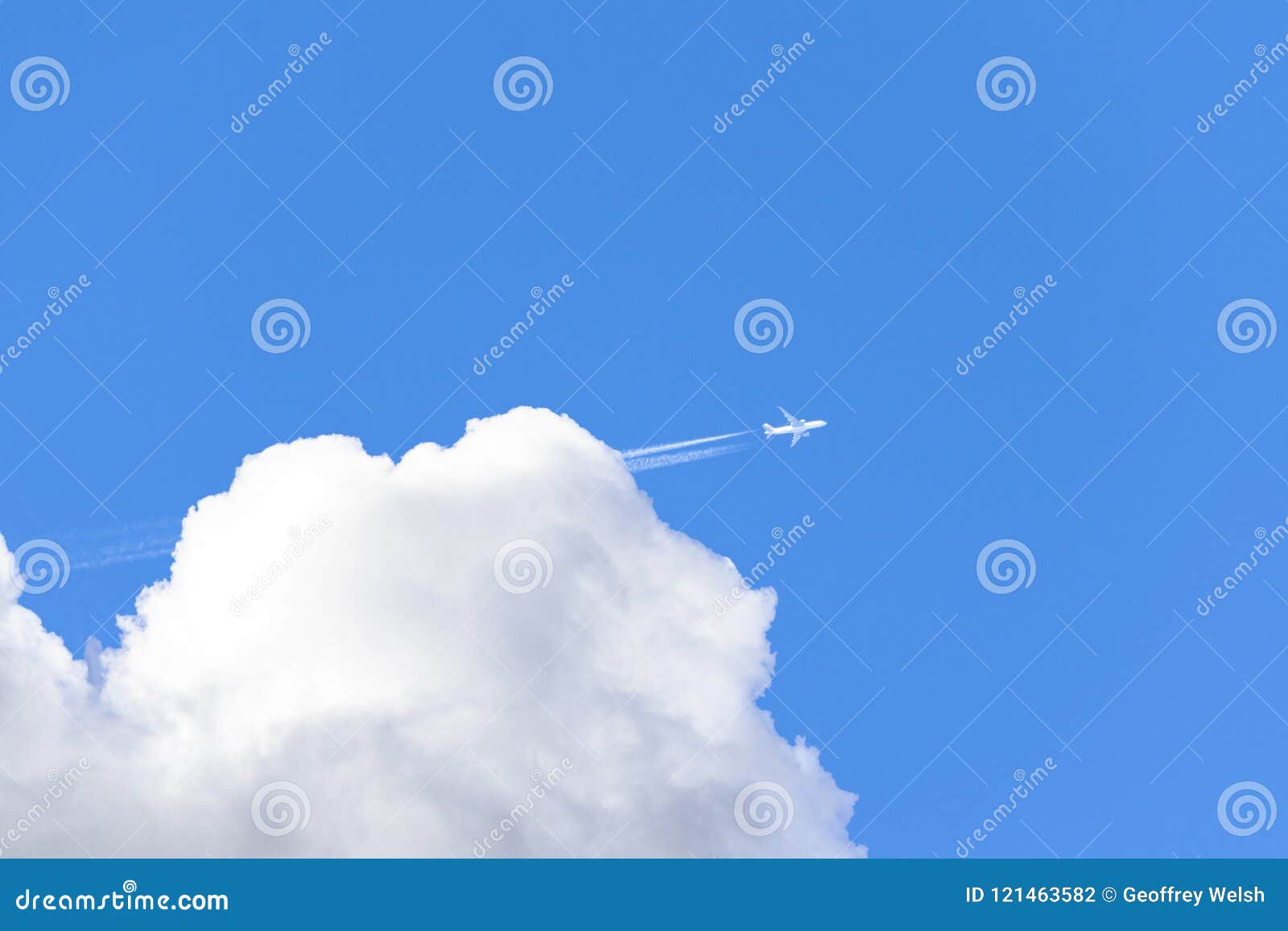 Jet Plane Flying Out of the Clouds Stock Photo - Image of vapour ...