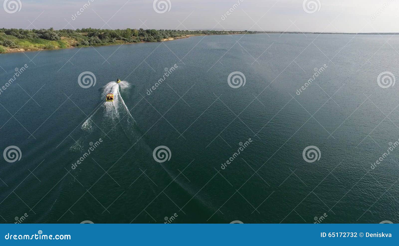 Jet Ski Pulling Inflatable Raft with a Man Stock Footage - Video of ...