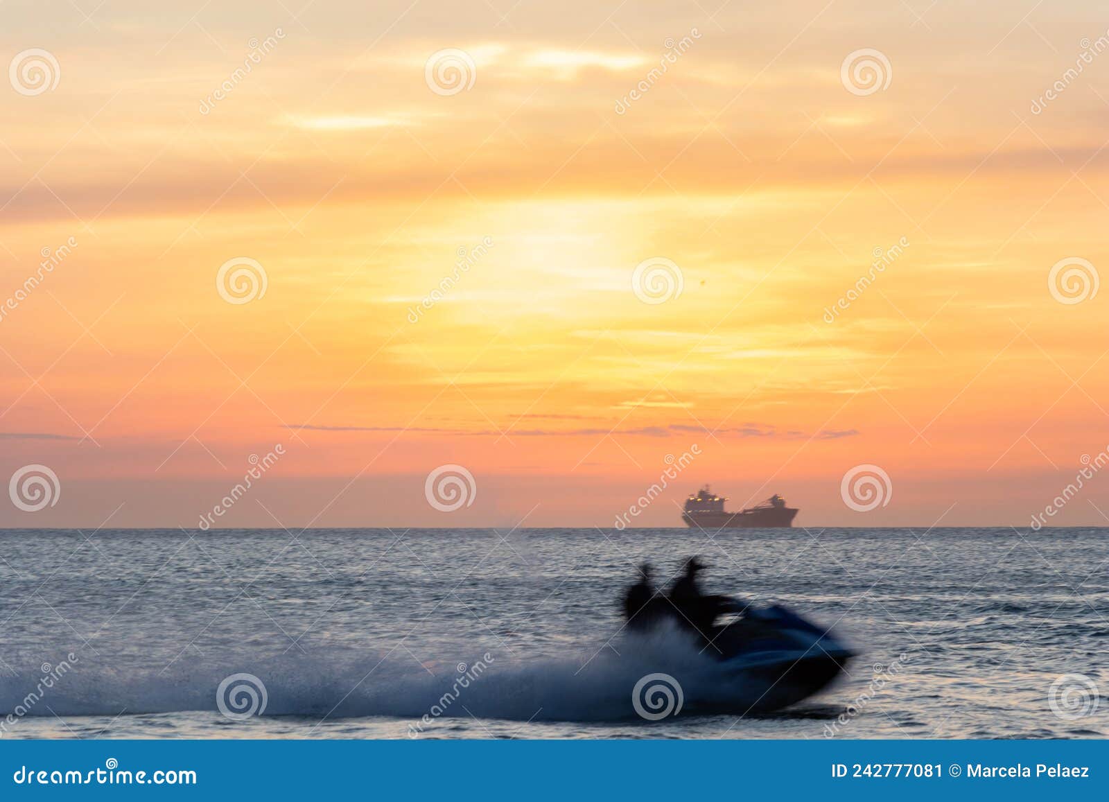 Jet ski in a sunset at sea stock image. Image of marin - 242777081