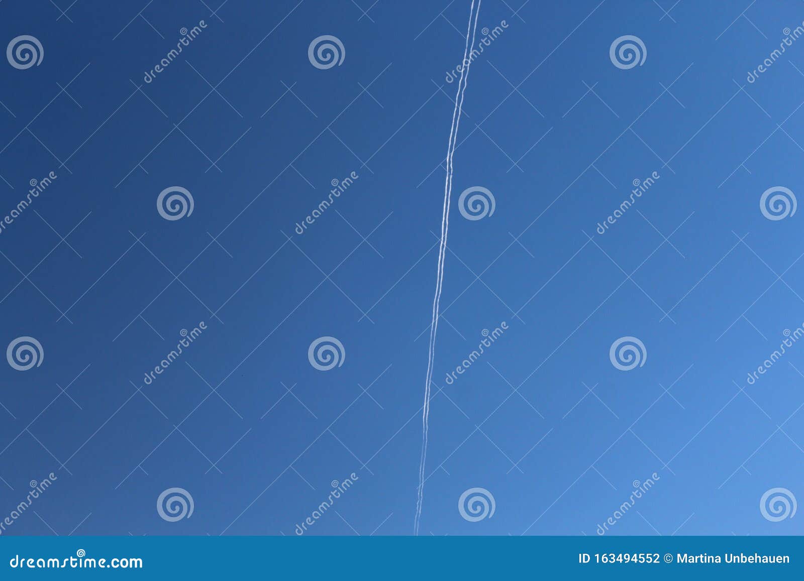 Jet trail on the blue sky stock photo. Image of plane - 163494552