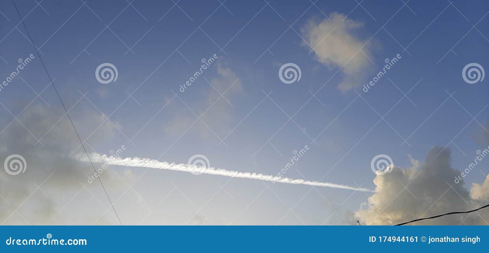 Jet trail stock image. Image of jetsmoke, trail, clouds - 174944161