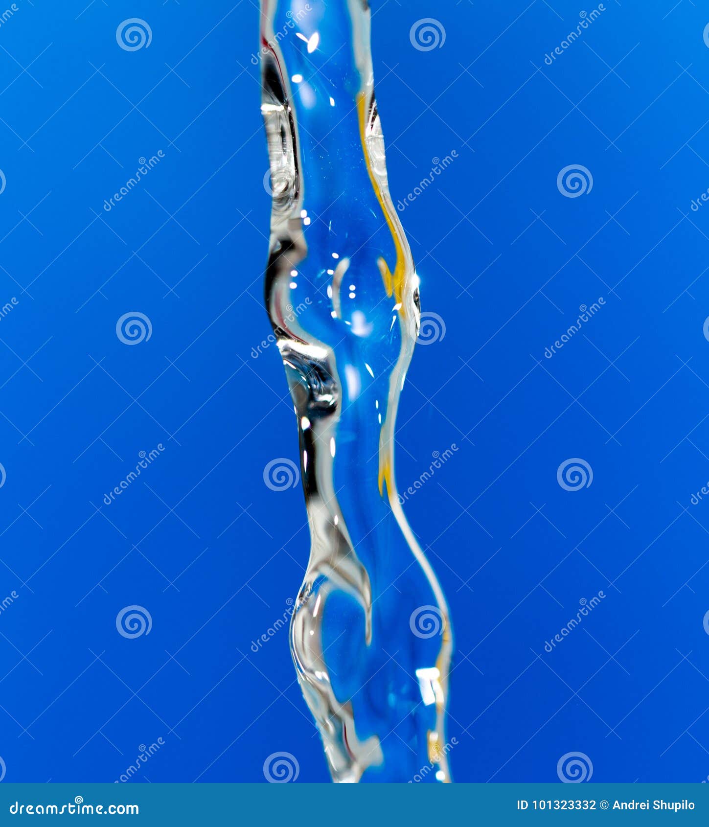 A Jet of Water on a Blue Background Stock Photo - Image of splashing ...