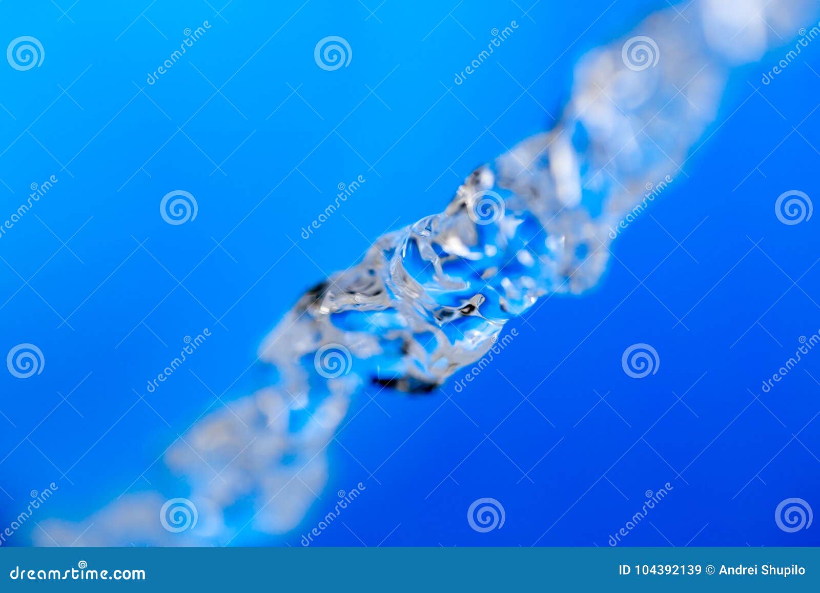 A Jet of Water on a Blue Background Stock Image - Image of scene, cold ...