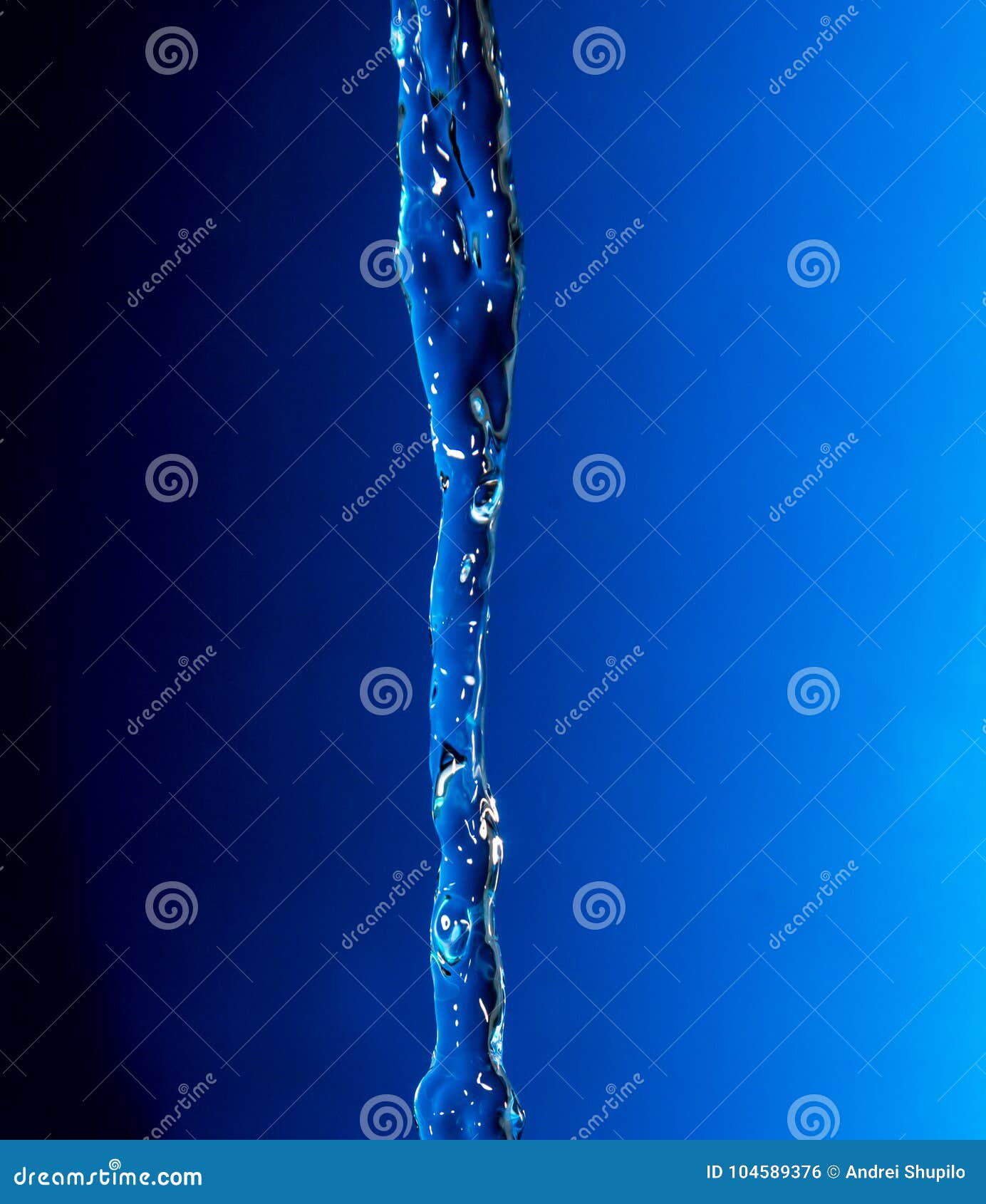 A Jet of Water on a Blue Background Stock Photo - Image of background ...