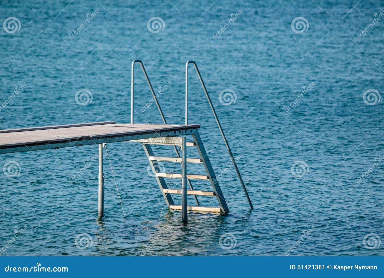 Jetty at a blue ocean stock image. Image of morning, dock - 61421381
