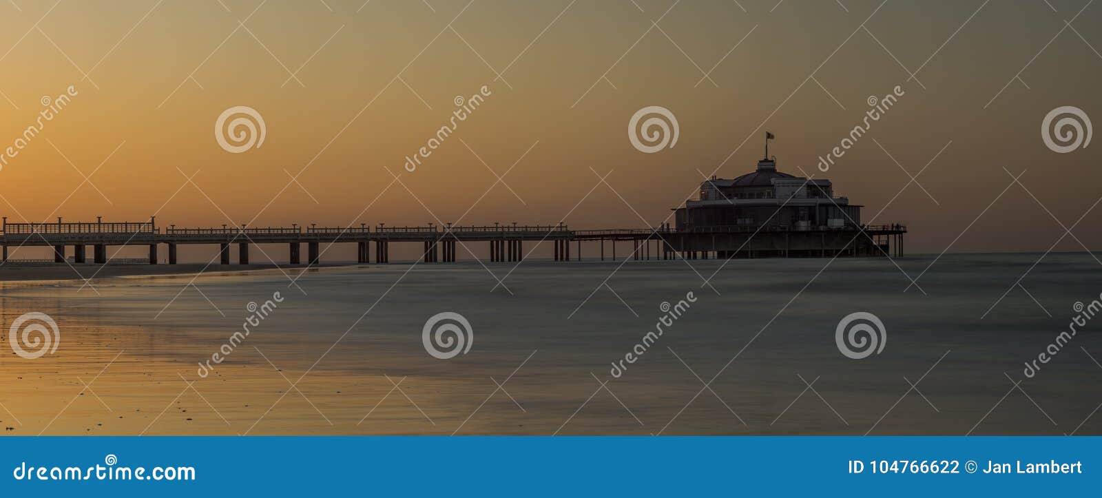 Jetty with fire in the sky stock photo. Image of sunset - 104766622