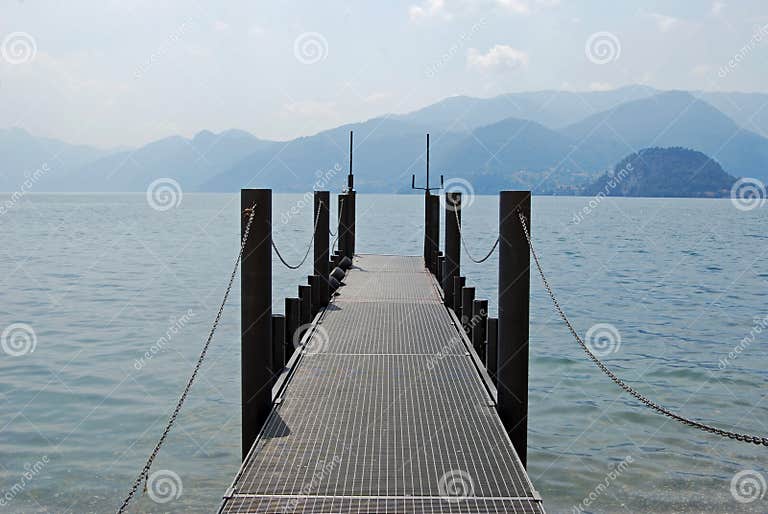 Jetty on Lake Como, Italy stock image. Image of mountain - 15282385