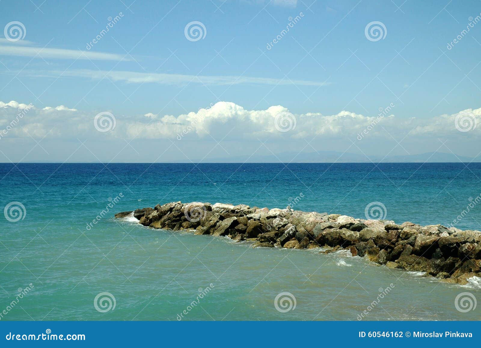 Jetty from large stones stock photo. Image of cloud, europe - 60546162
