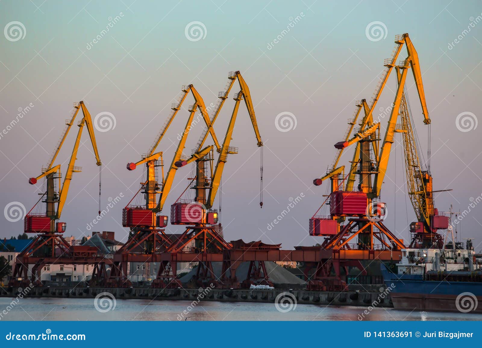 Jetty with port cranes stock image. Image of port, island - 141363691