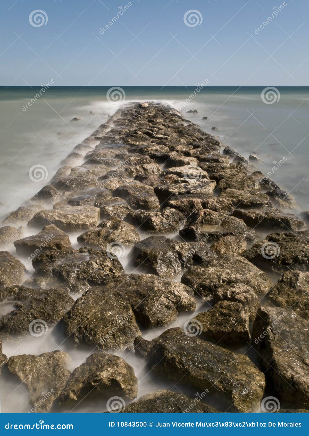 Jetty of Rocks to the Sea stock photo. Image of walkway - 10843500