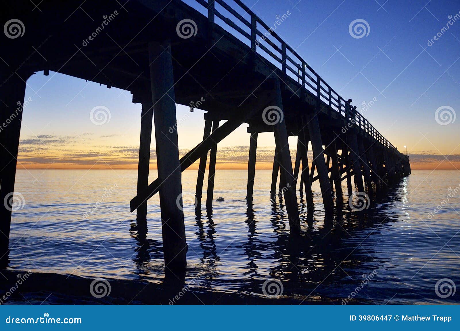 Jetty silhouette at sunset stock image. Image of coastline - 39806447