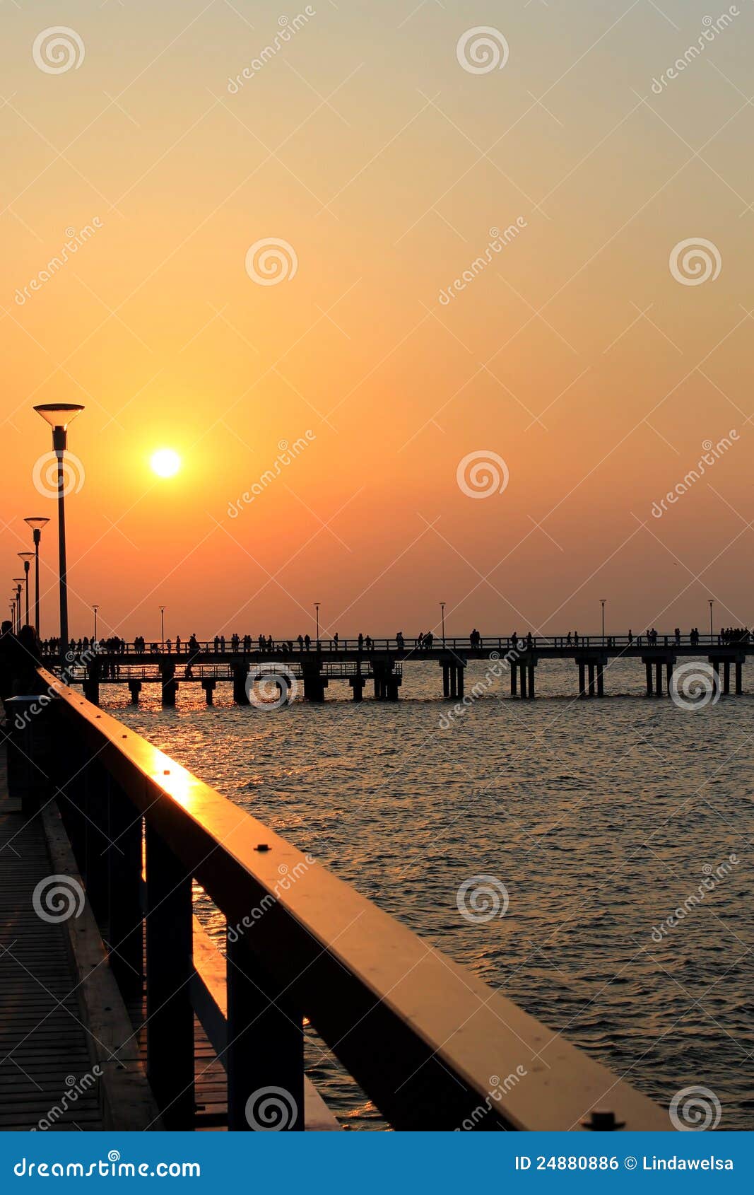 Jetty into sunset stock photo. Image of reflection, pier - 24880886