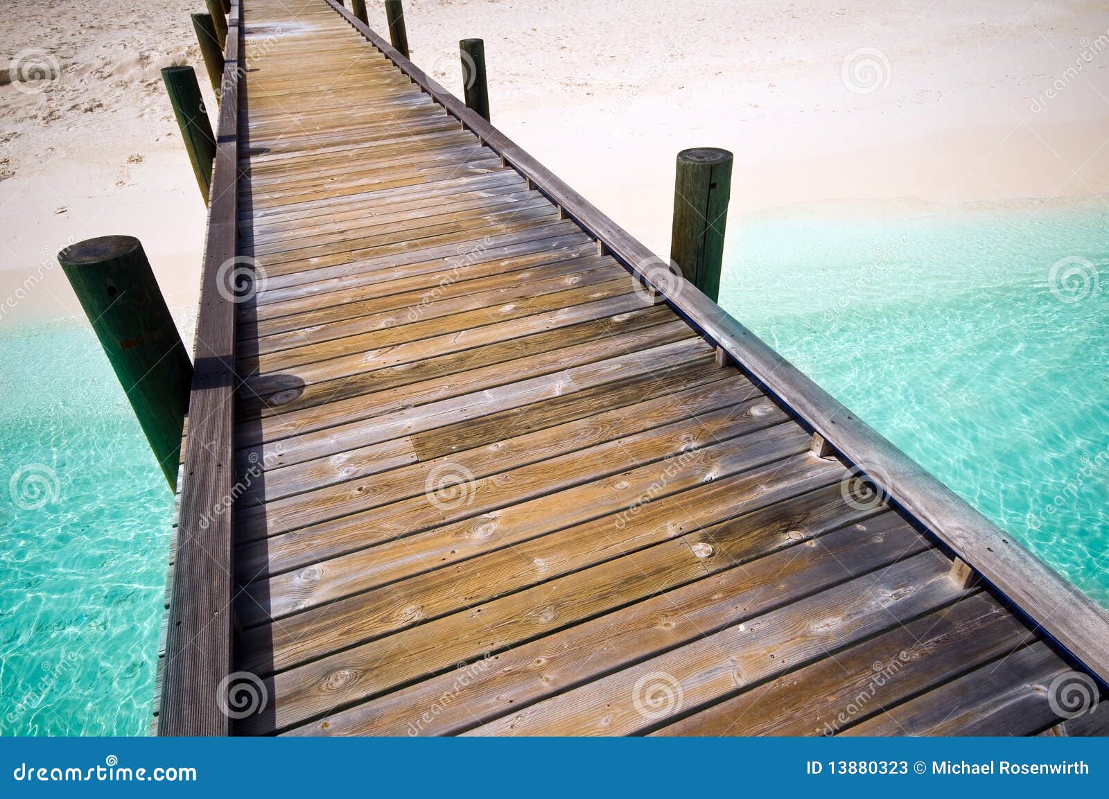 Jetty to a tropical beach stock image. Image of wooden - 13880323