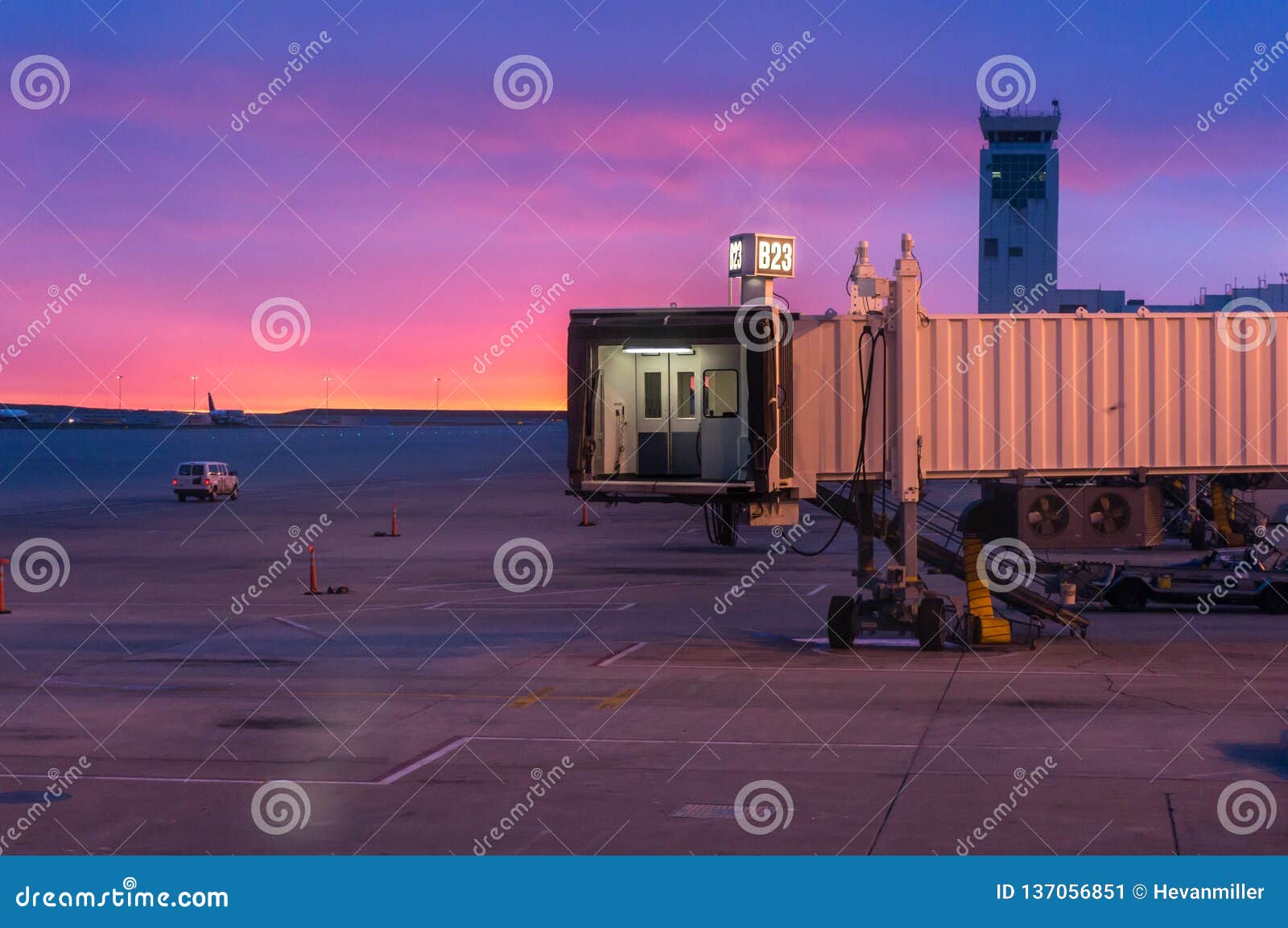 Jetway Doors On And Airport Runway At Sunrise With Flight Control Tower ...