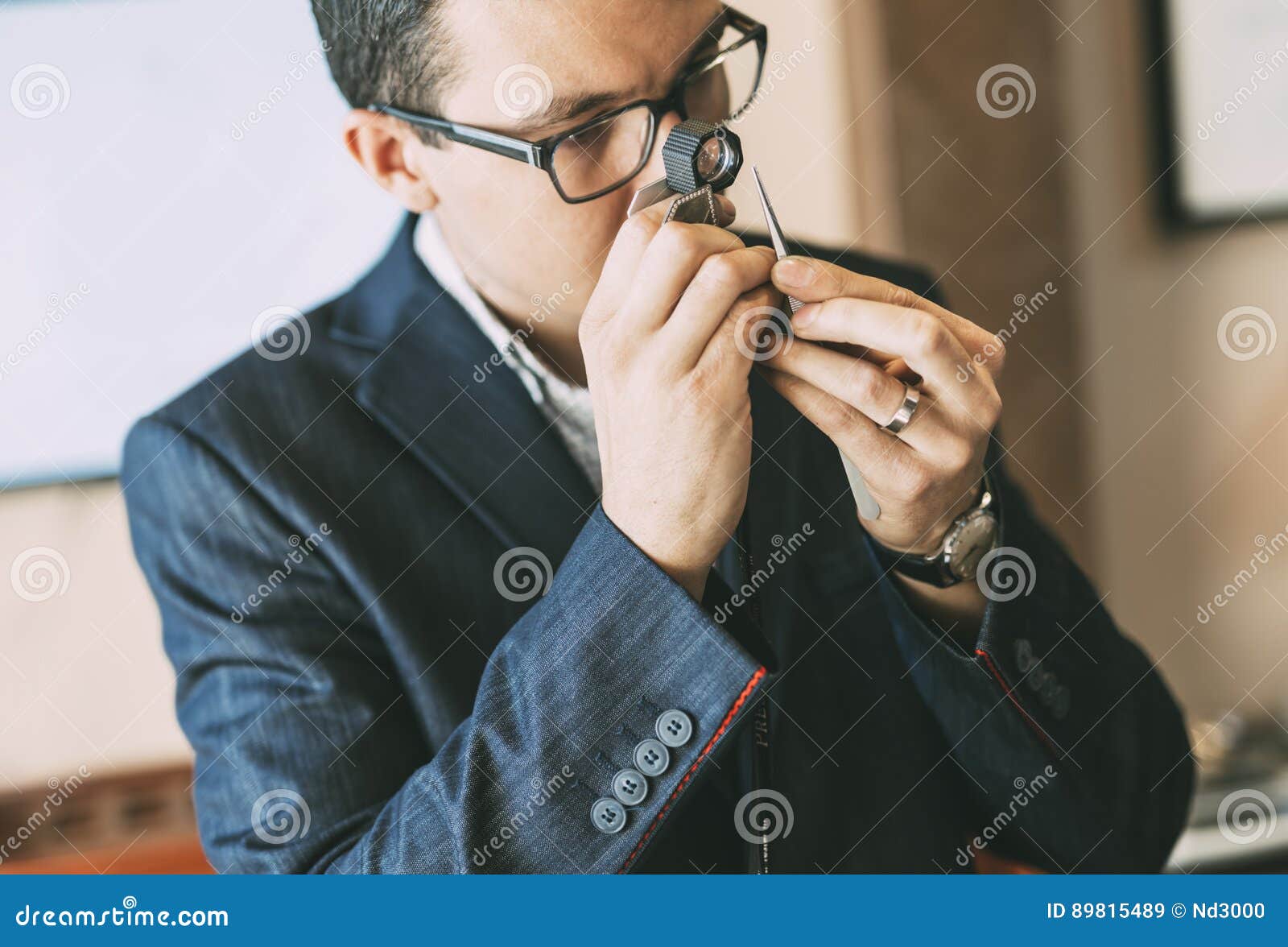Jeweler Examining Diamond through Loupe Stock Image - Image of closeup ...