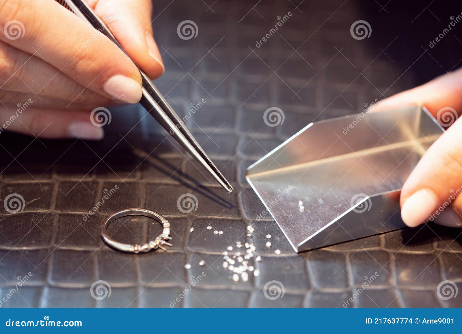 Jeweler Sorting Thru Little Diamonds in Her Workshop Stock Photo ...