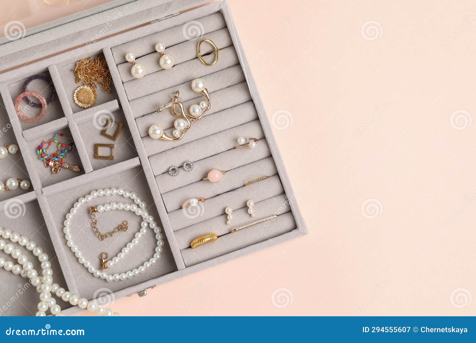 Jewelry Box with Many Different Accessories on Beige Background, Top ...