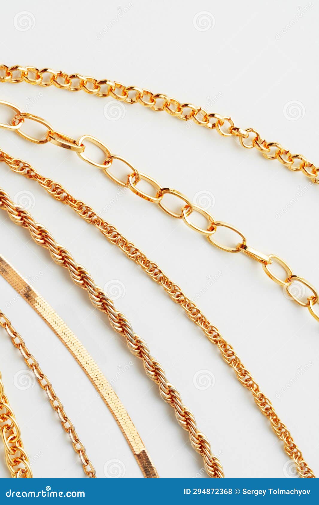 Jewelry Set of Golden Chains on the White Background Stock Photo ...