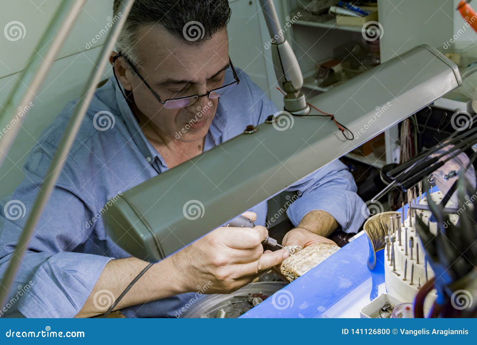 Jewelry worker in his lab editorial image. Image of goldsmith - 141126800