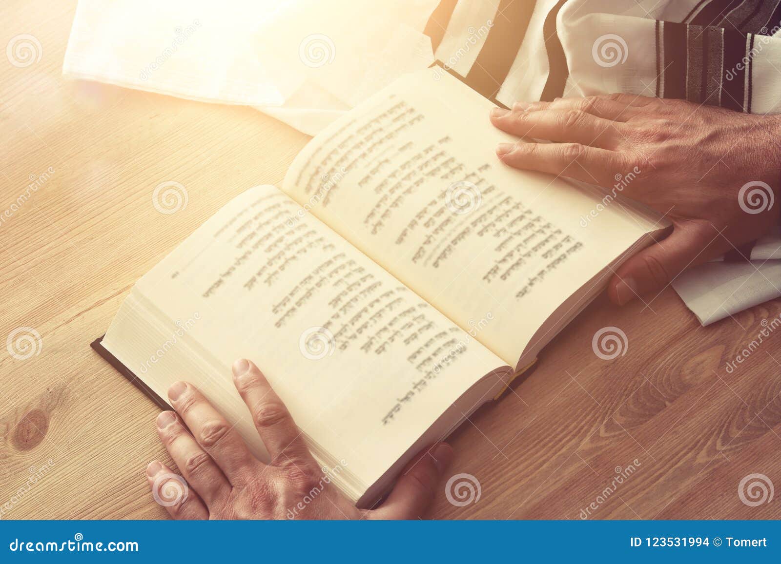 Jewish Man Hands Holding a Prayer Book, Praying, Next To Tallit. Jewish ... Jewish Man Hands Holding a Prayer Book, Praying, Next To Tallit. Jewish ...