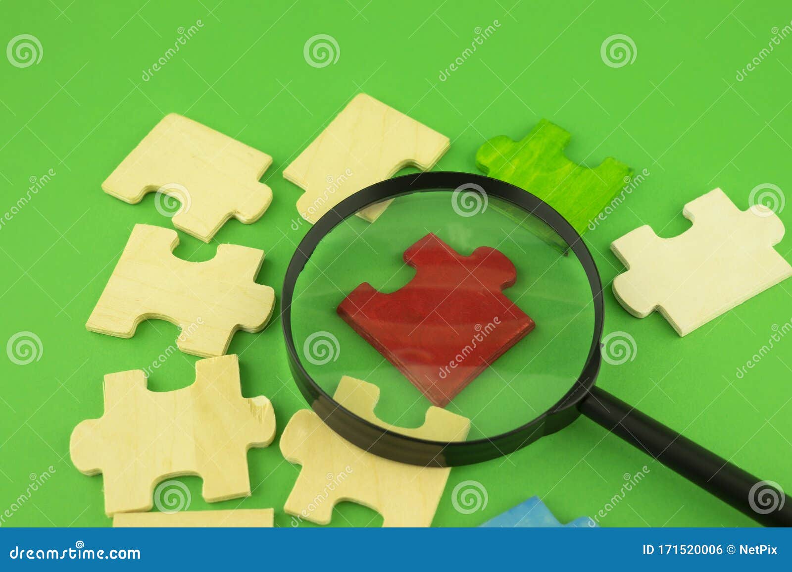 Jigsaw Puzzle Pieces with Magnifying Glass Stock Photo - Image of ...