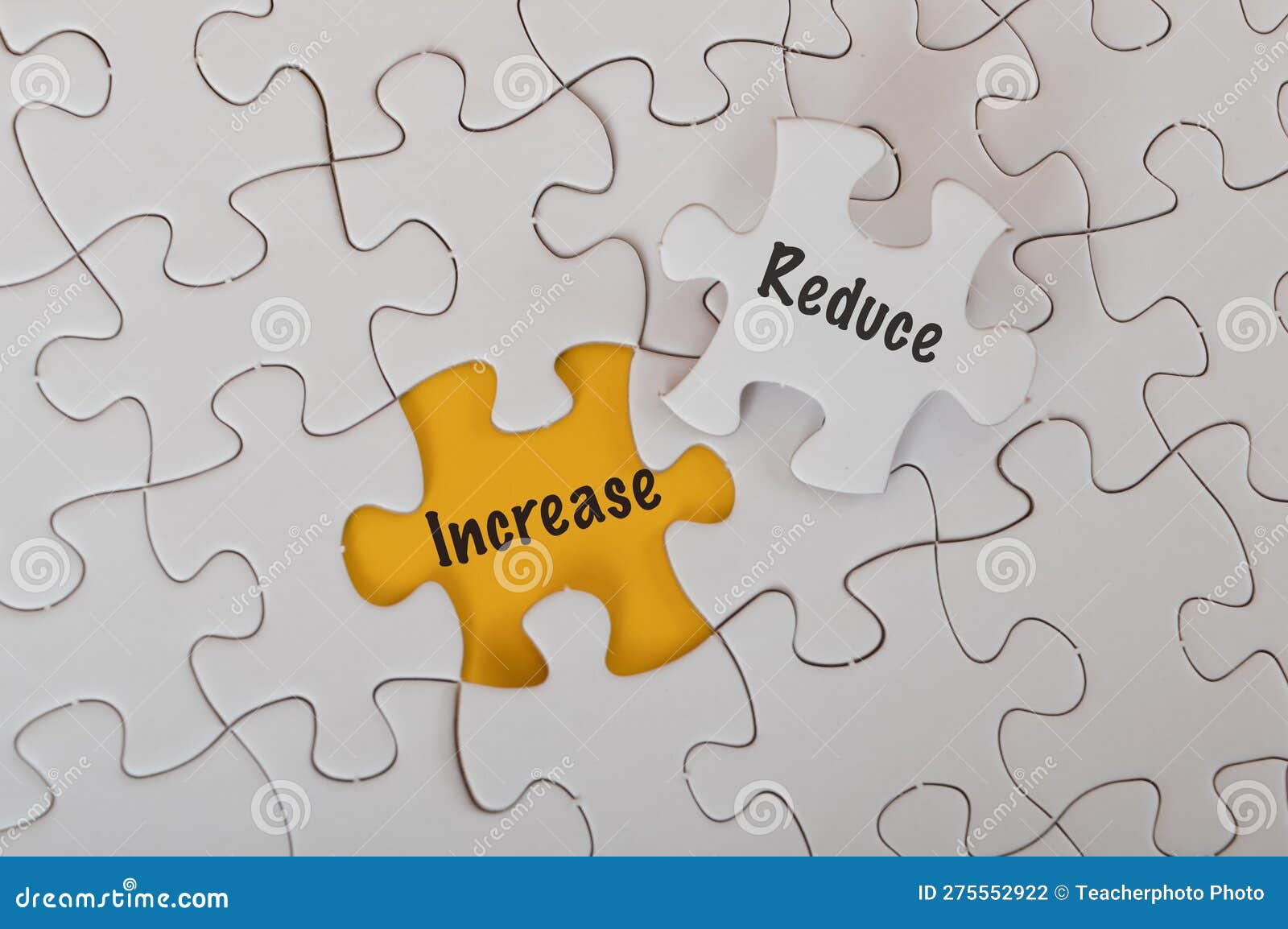 Jigsaw Puzzles with Text REDUCE and INCREASE Isolated on a Yellow ...