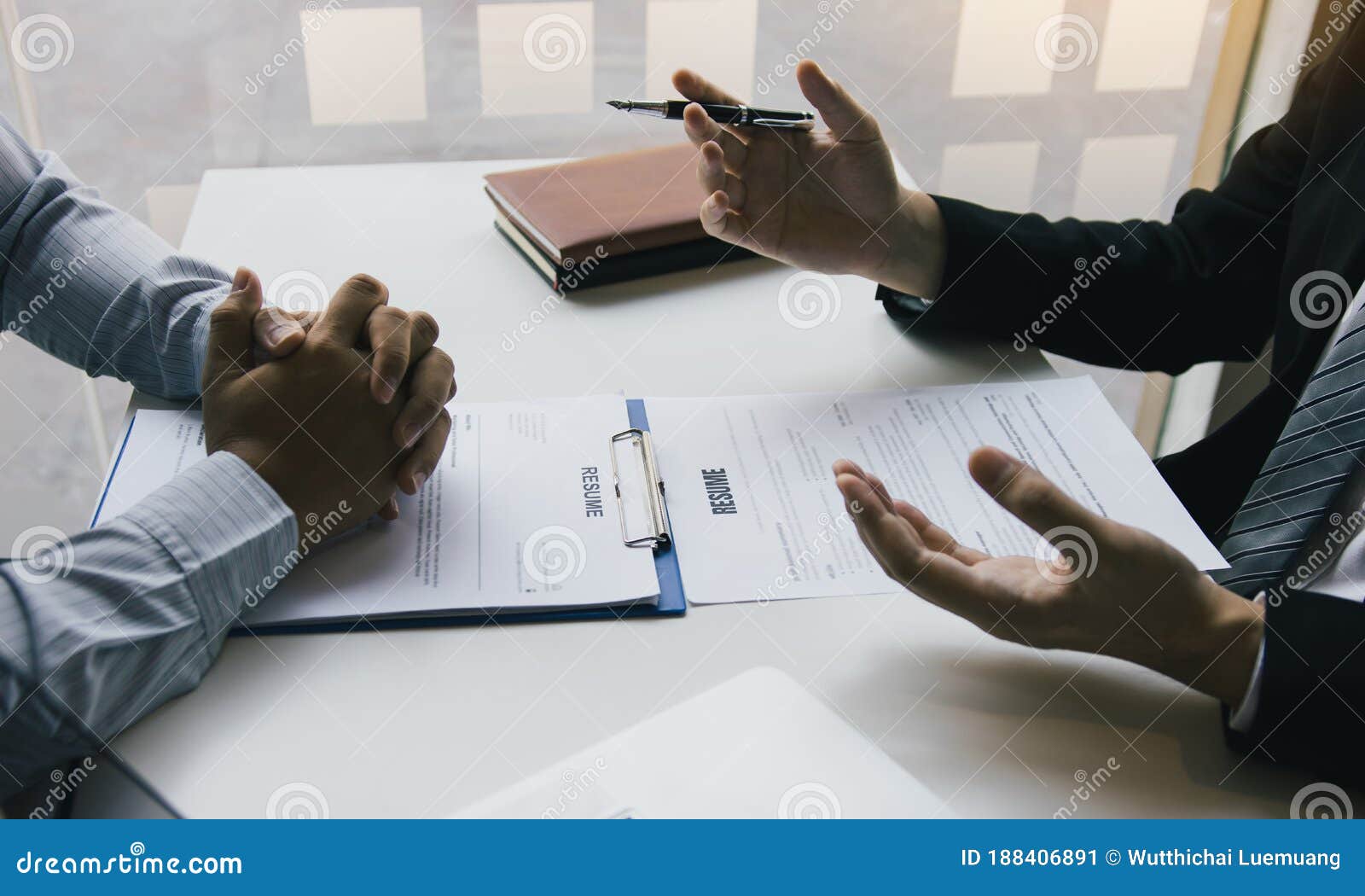 Job Applicants are Holding a Resume Document in the Job Interview Room ...