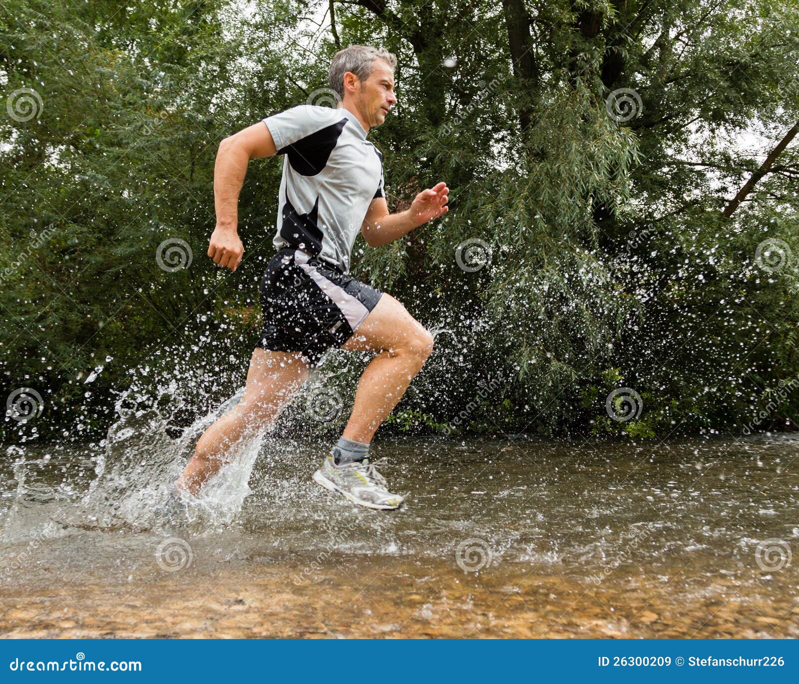 Jogger Running through a Streambed Stock Image - Image of river, jump ...