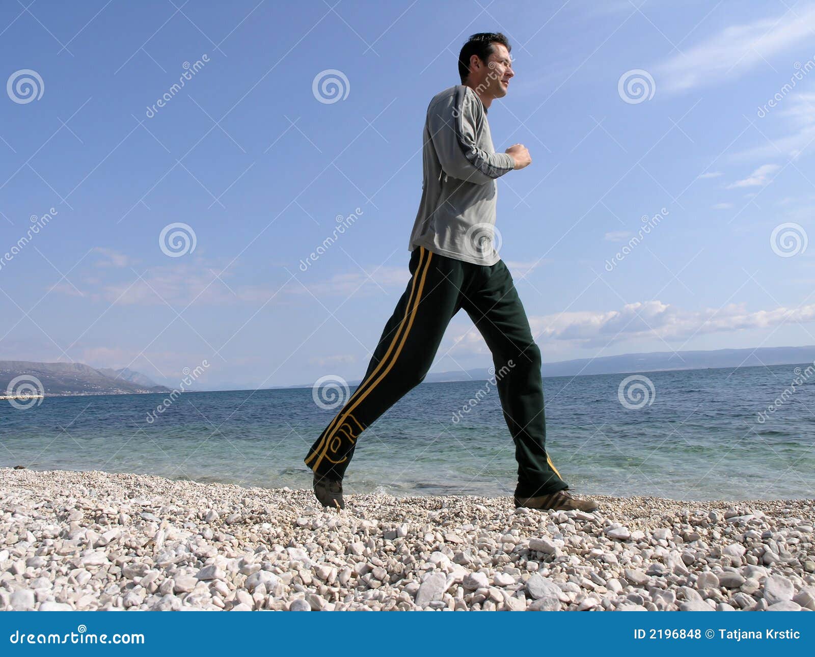 Jogging at the beach stock photo. Image of adult, energy - 2196848