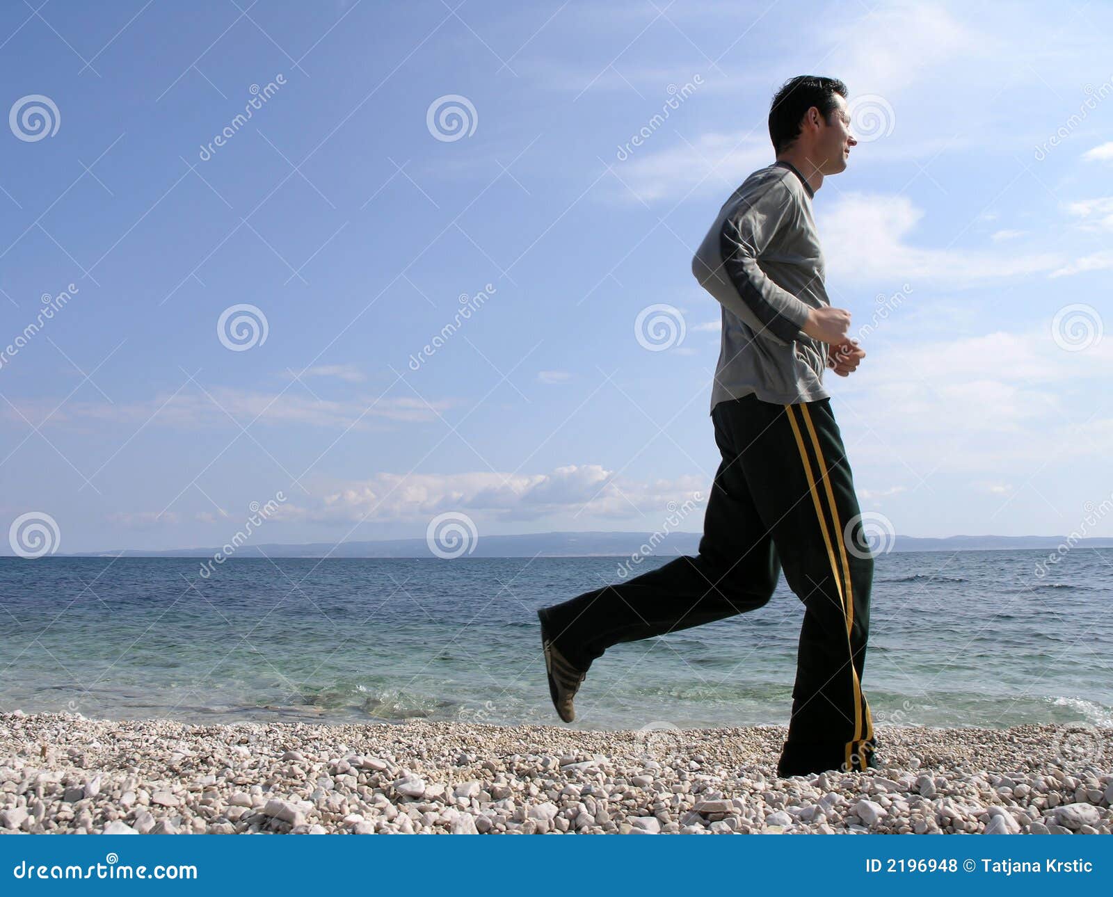 Jogging at the beach stock photo. Image of lifestyles - 2196948