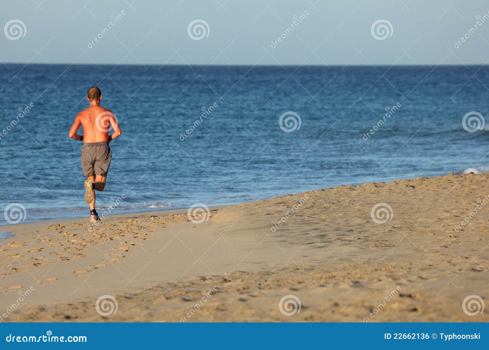 Jogging on the beach stock photo. Image of workout, shore - 22662136