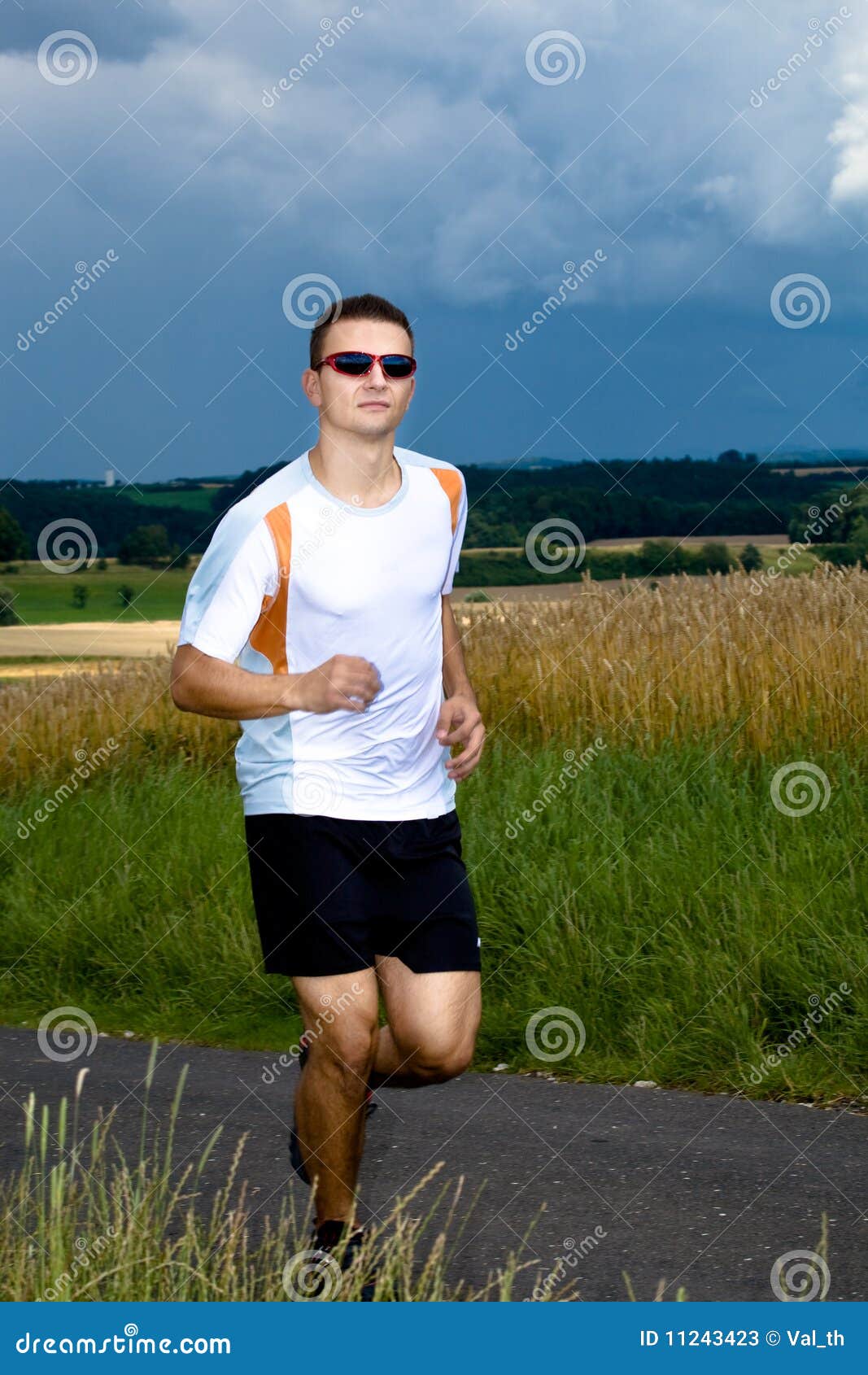 Jogging through the fields stock image. Image of running - 11243423