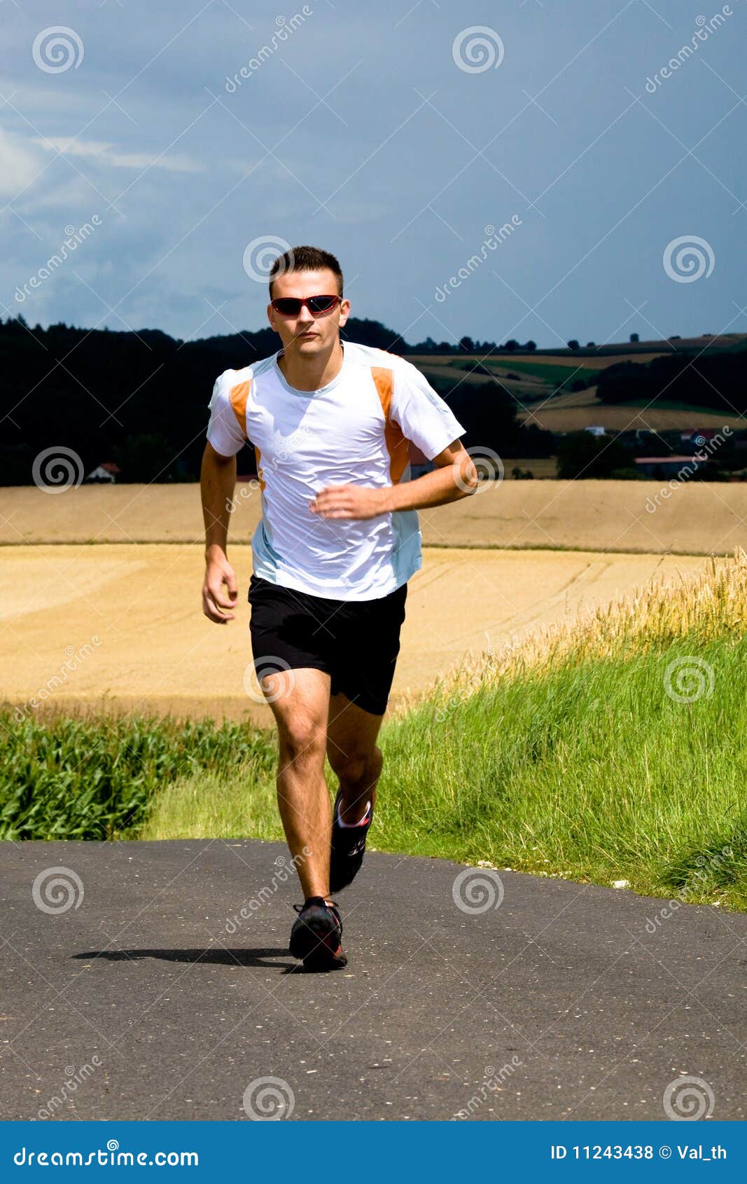 Jogging through the fields stock photo. Image of male - 11243438