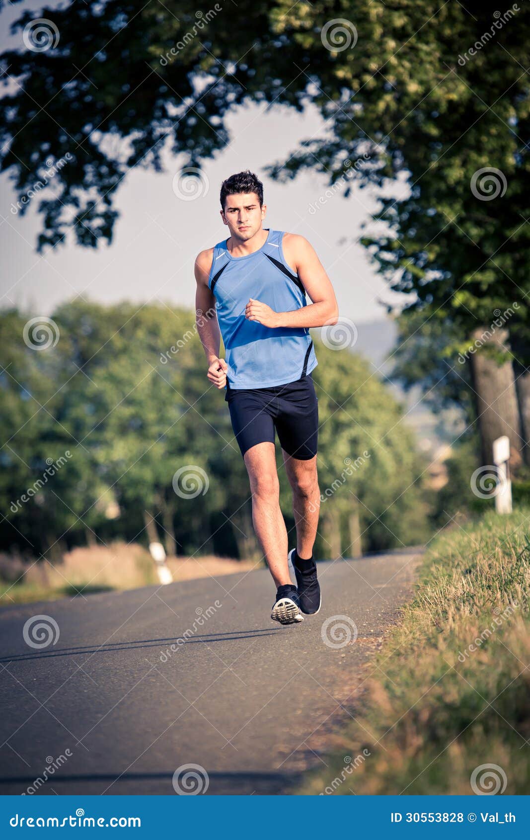 Jogging through the fields stock photo. Image of male - 30553828