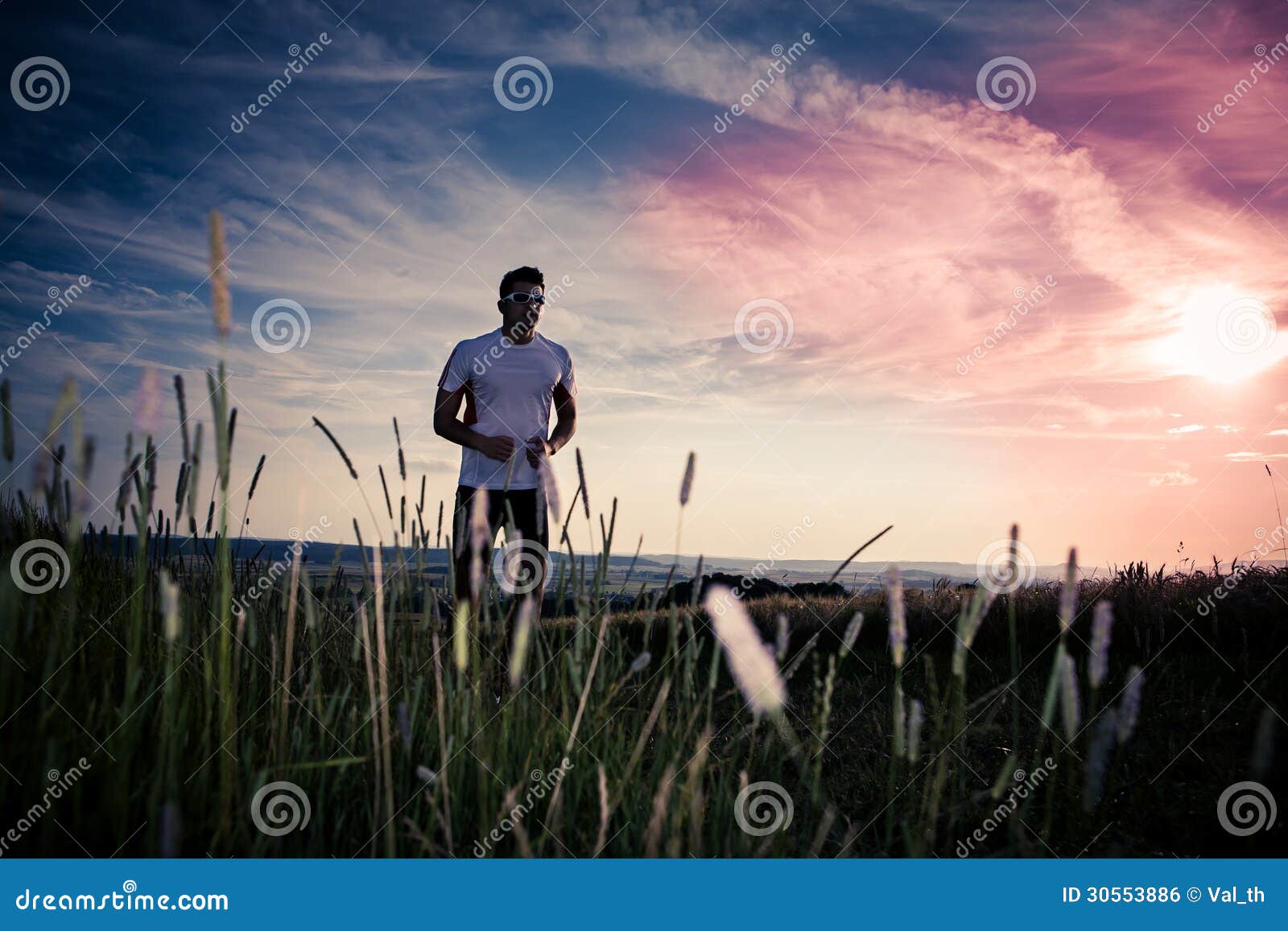 Jogging through the fields stock photo. Image of competition - 30553886