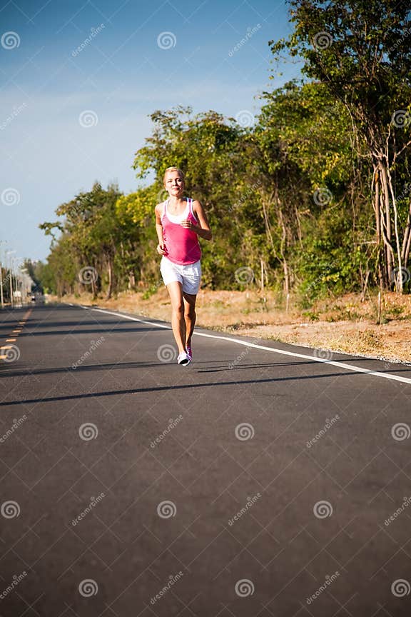 Jogging on the road stock photo. Image of cross, lifestyle - 13050978